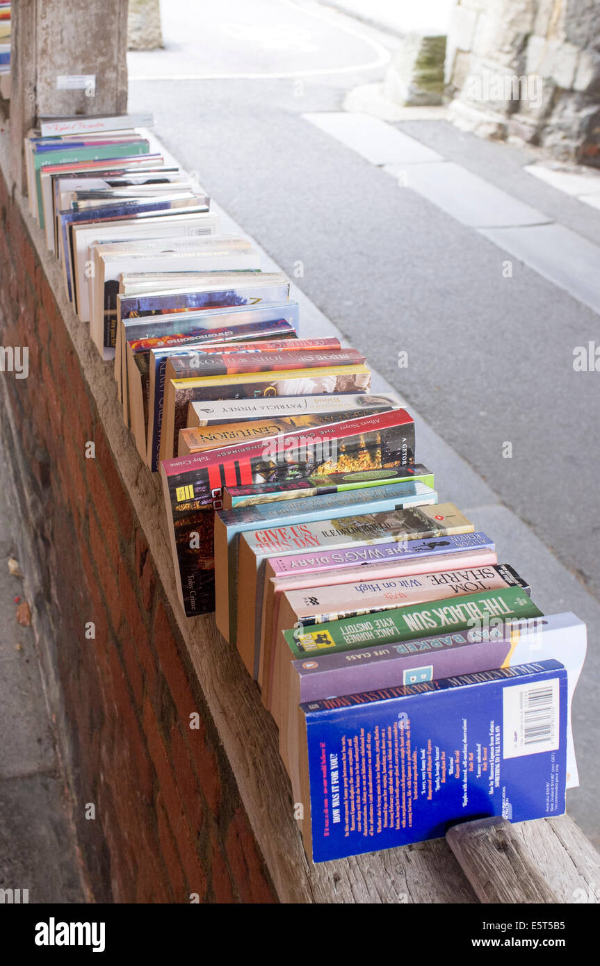 Second hand books for sale displayed on top of wall outside Kingsgate ...