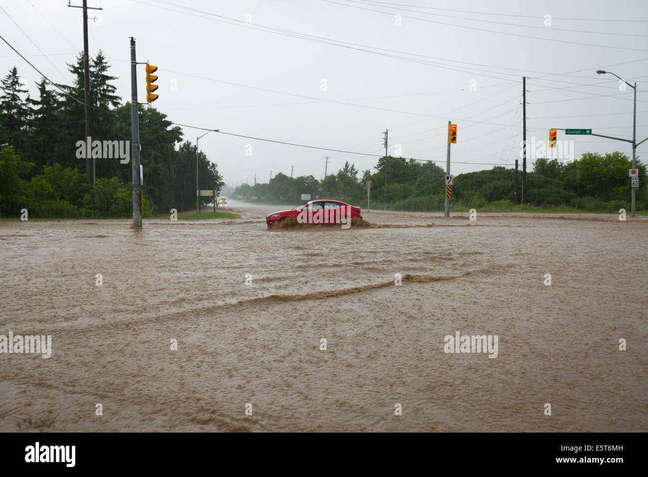 Thunderstorms create flash flooding in Oakville, Ontario turning roads ...