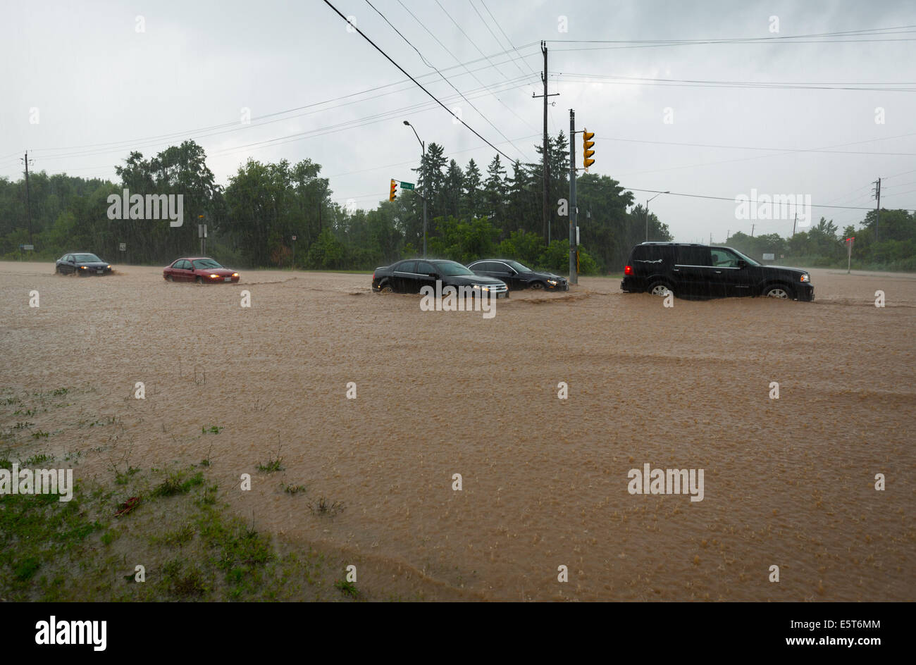 Thunderstorms create flash flooding in Oakville, Ontario turning roads ...