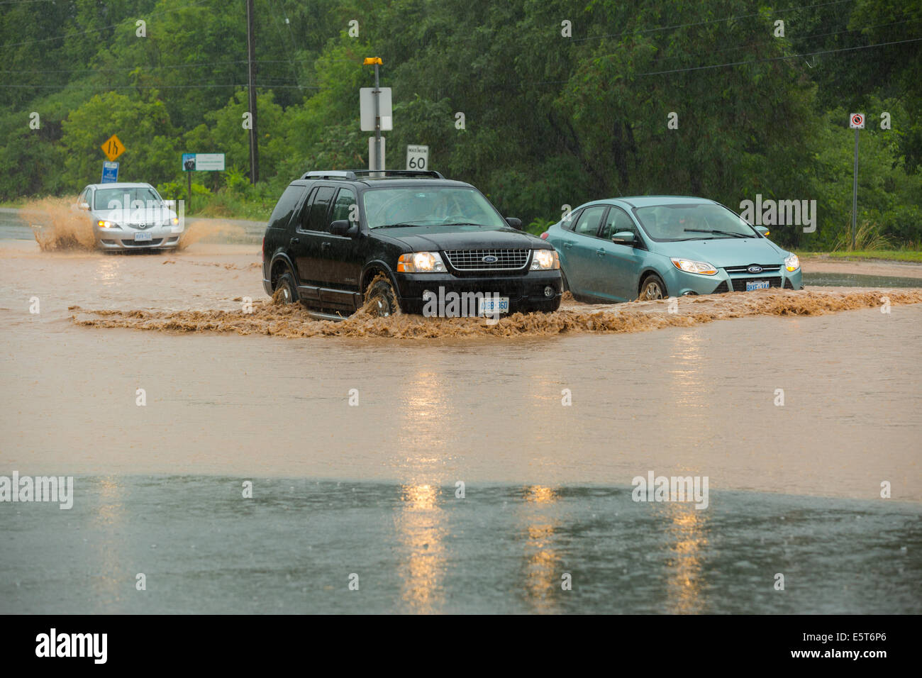 Thunderstorms create flash flooding in Oakville, Ontario turning roads ...