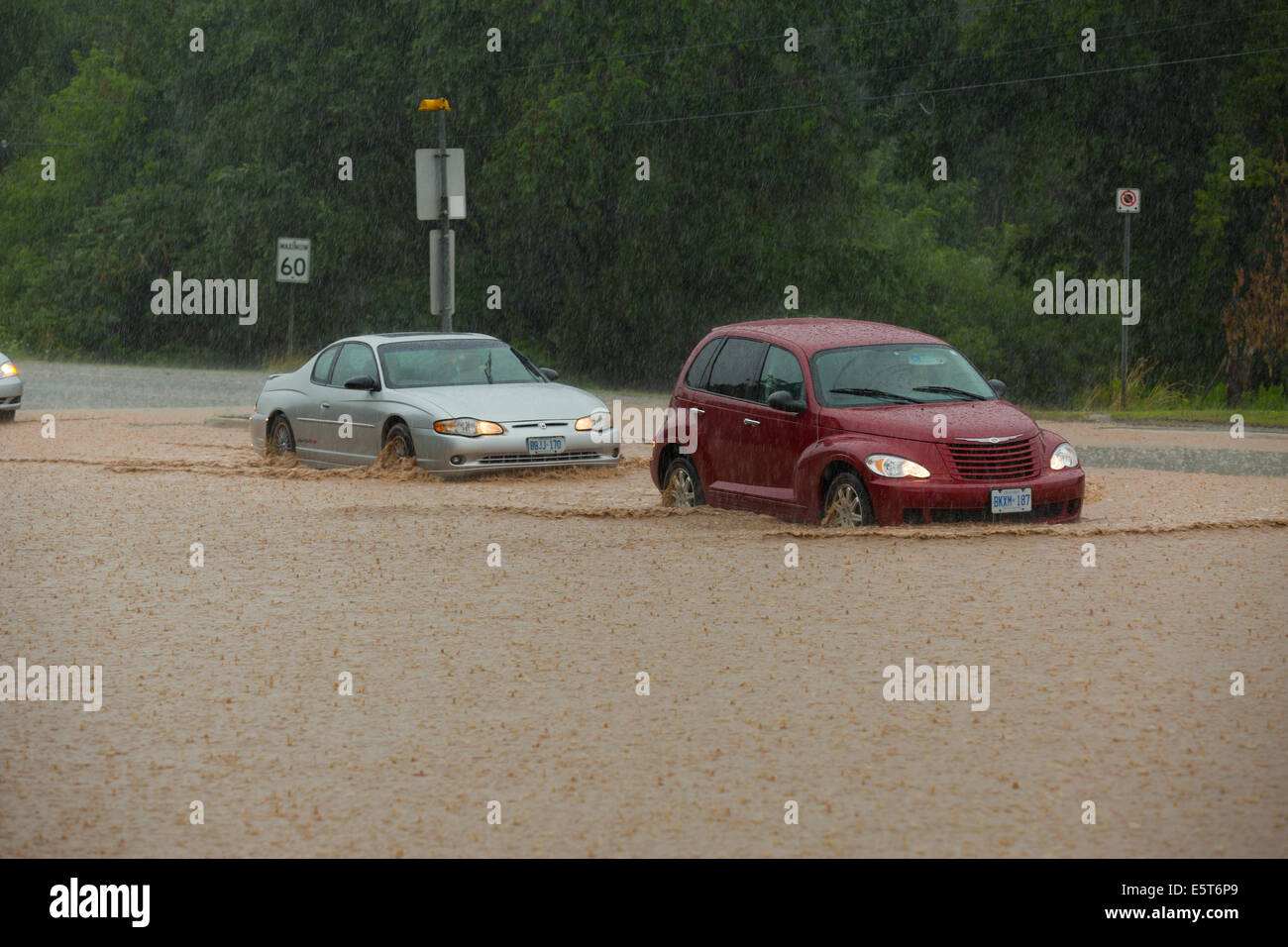 Thunderstorms create flash flooding in Oakville, Ontario turning roads ...