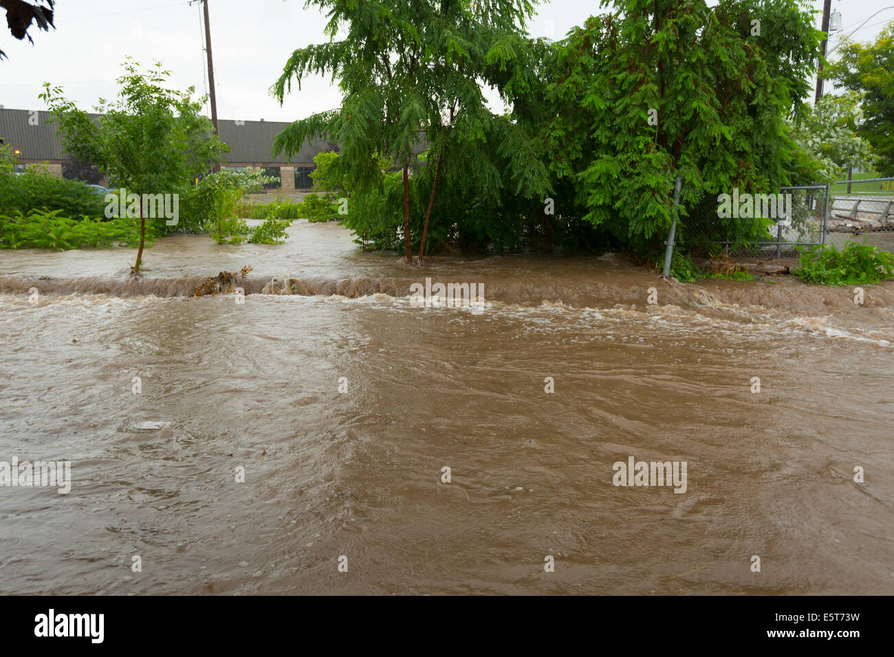 Thunderstorms create flash flooding in Oakville, Ontario turning roads ...