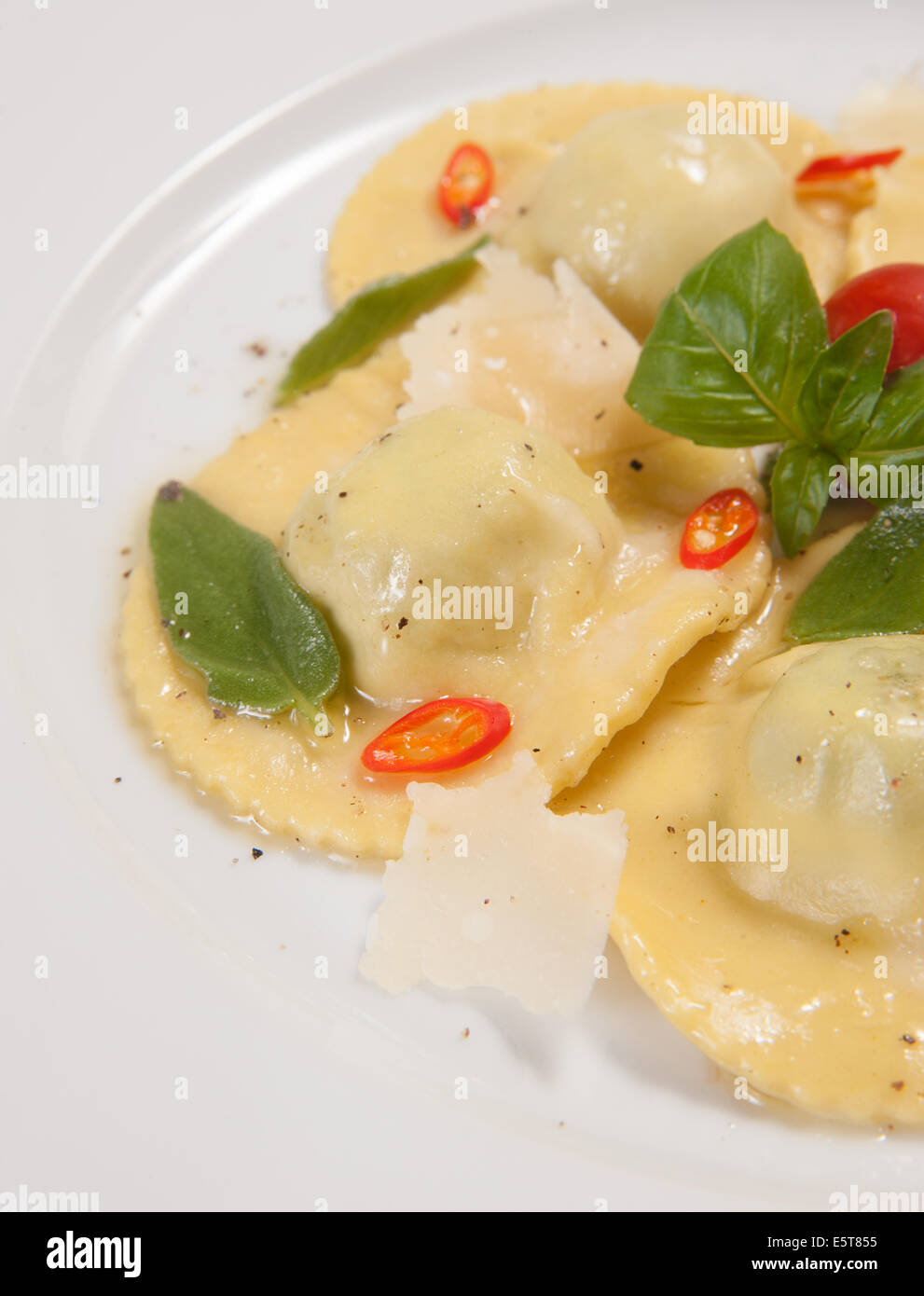 Ravioli with red chily pepper and sweet basil Stock Photo - Alamy