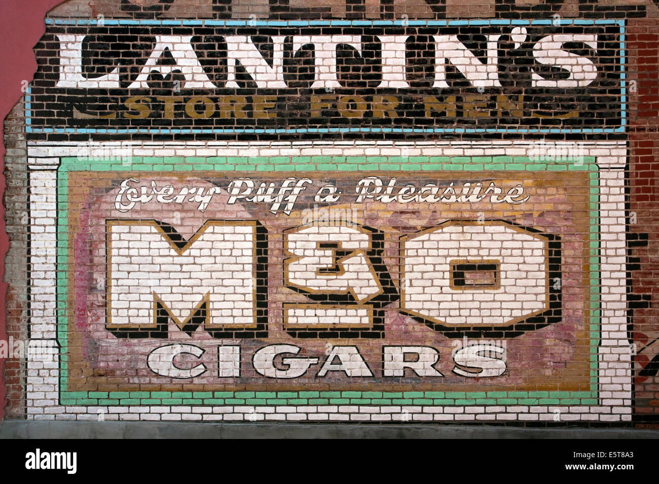 Painted sign on a brick wall hi-res stock photography and images - Alamy