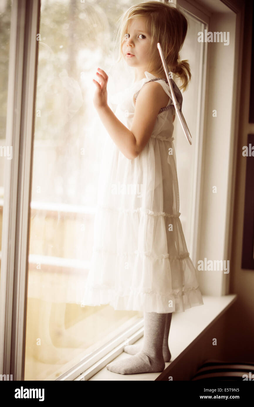 The girl by the window hi-res stock photography and images - Alamy
