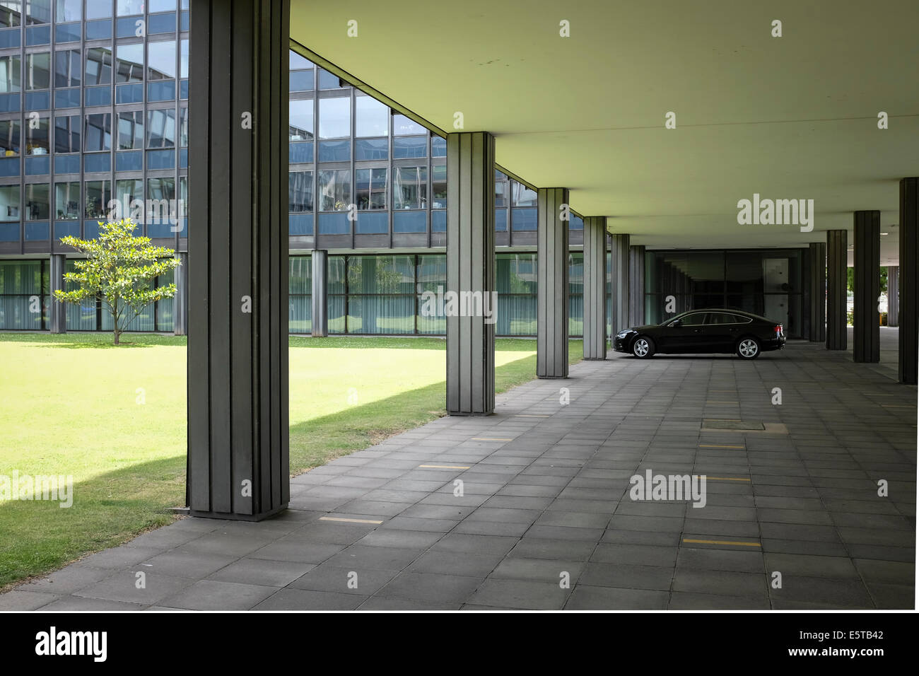 Black Audi car parked in a porch of an office building in Cologne ...