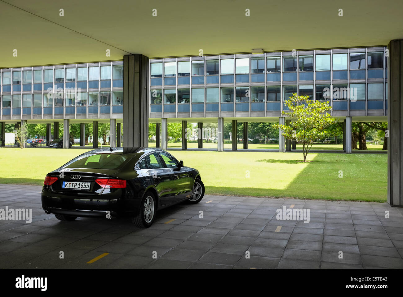 Black Audi car parked in a porch of an office building in Cologne ...