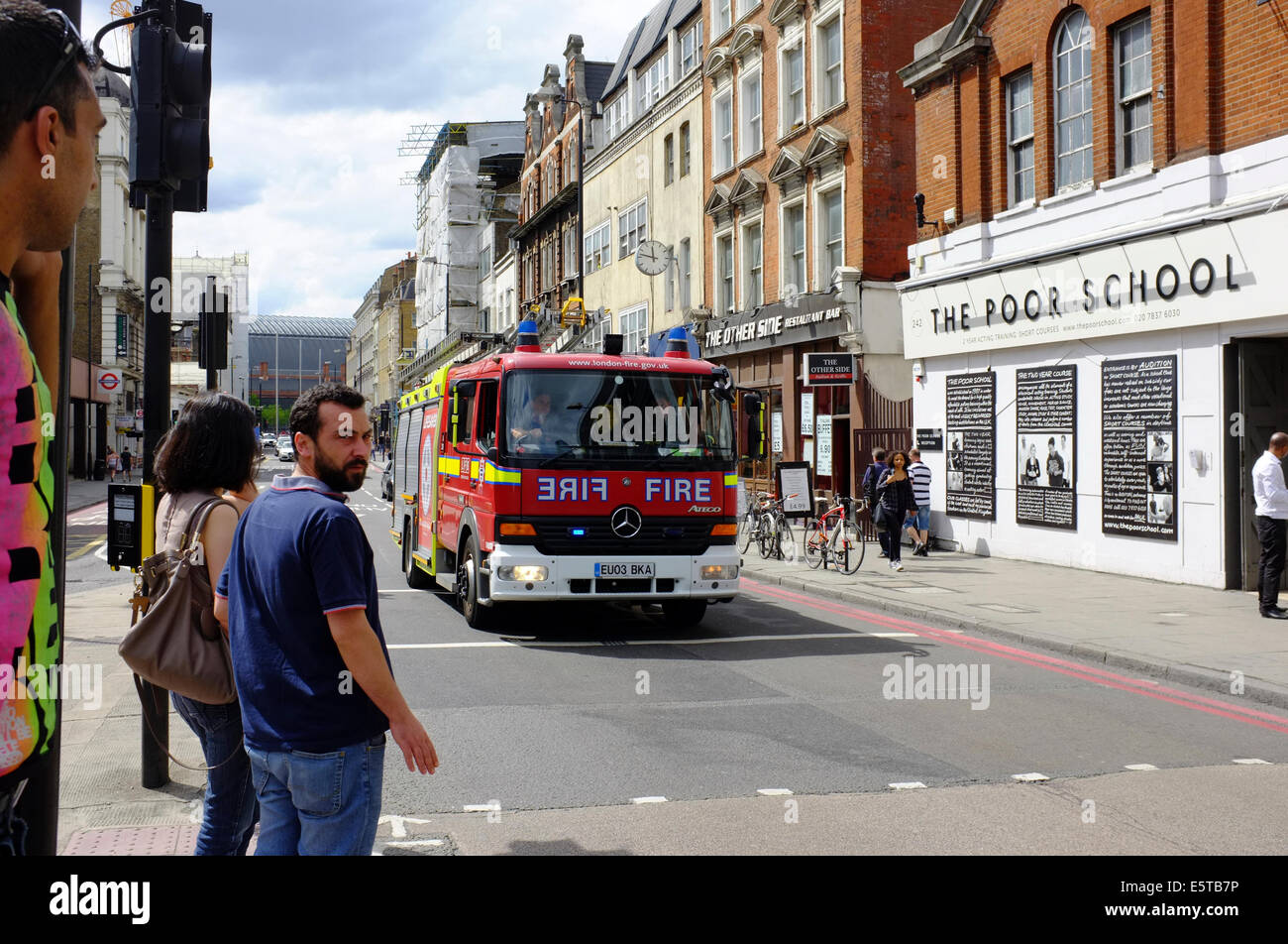 Fire brigade rushing to an emergency in London Stock Photo - Alamy