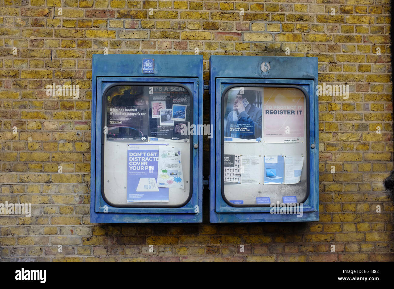 police notice cabinets on wall in London Stock Photo - Alamy