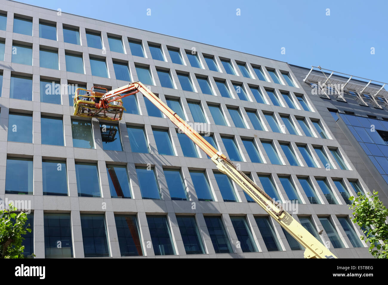 Crane for cleaning windows on office building in Brussels, Belgium ...