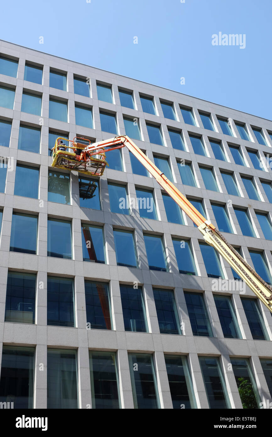 Crane for cleaning windows on office building in Brussels, Belgium ...