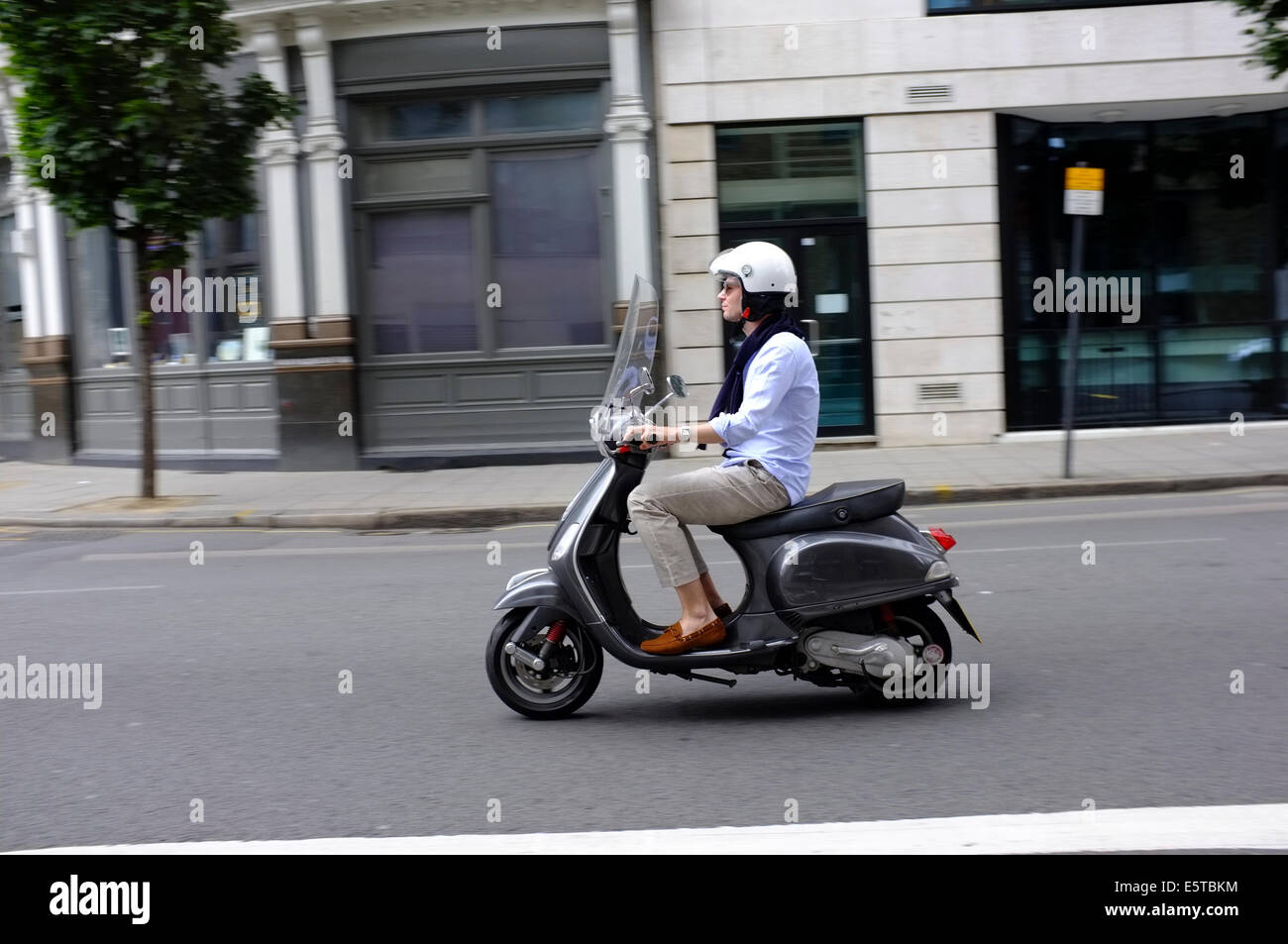man riding scooter in London Stock Photo - Alamy