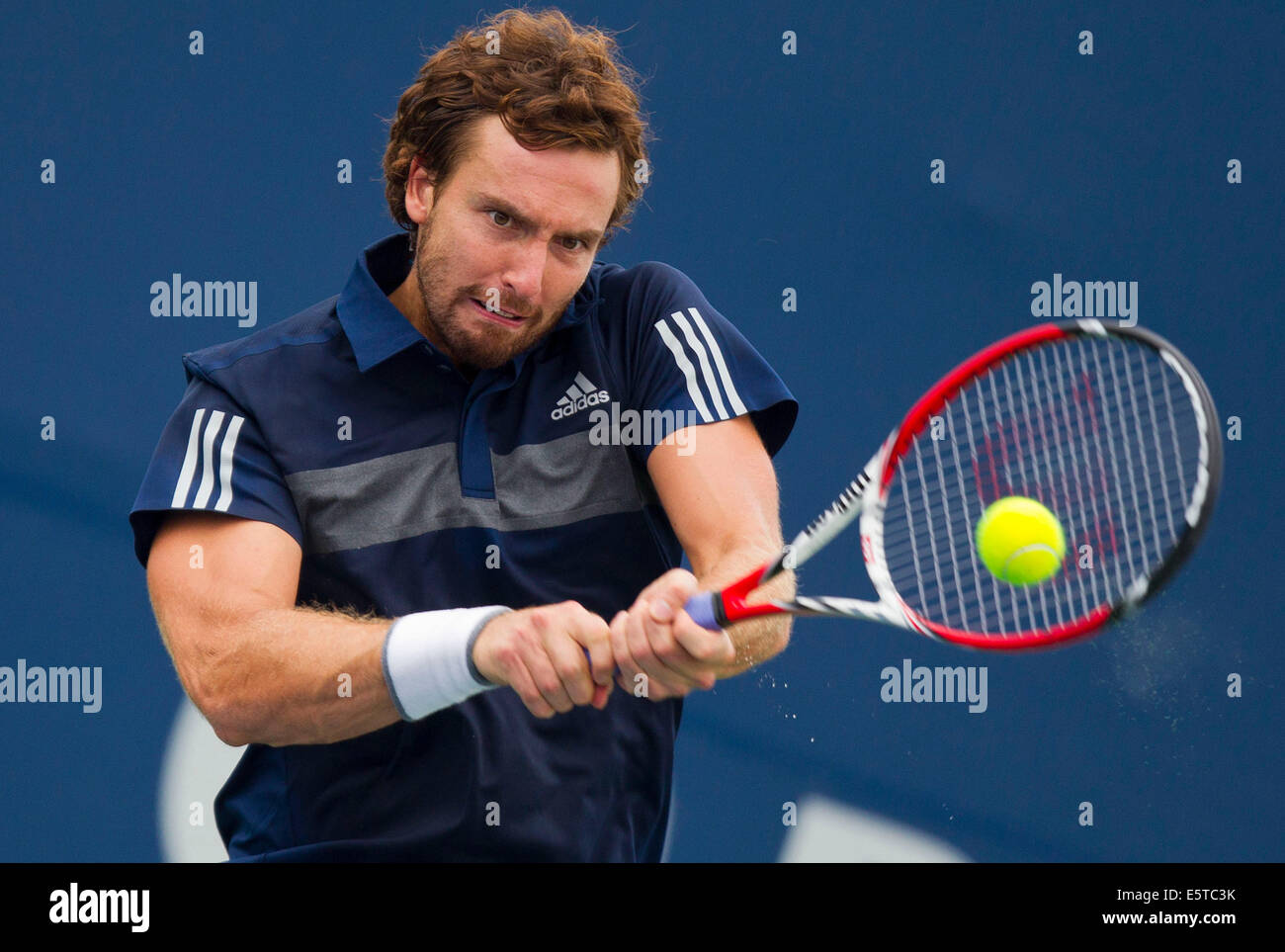 Toronto, Canada. 6th Aug, 2014. Ernests Gulbis of Latvia returns the ...