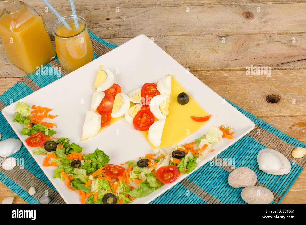 Colorful salad shaped as a fish, creative kid food Stock Photo - Alamy