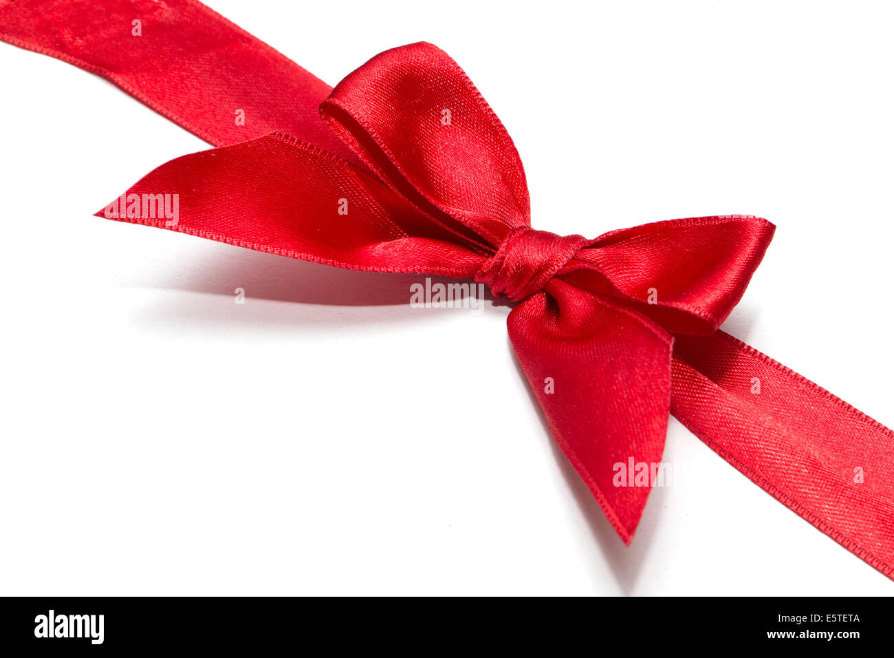 red ribbon with bow with tails isolated on white background Stock Photo ...