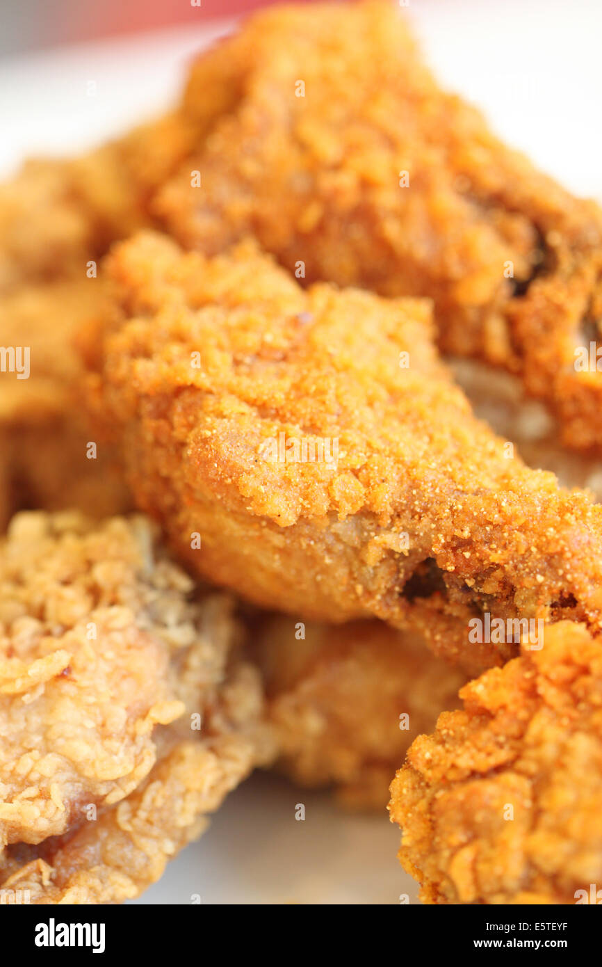Fried chicken on a dish in a restaurant Stock Photo - Alamy