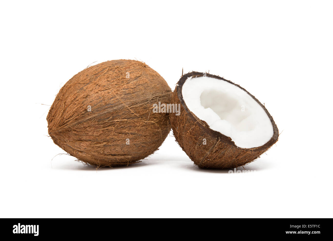 coconut cut in half on white background Stock Photo - Alamy