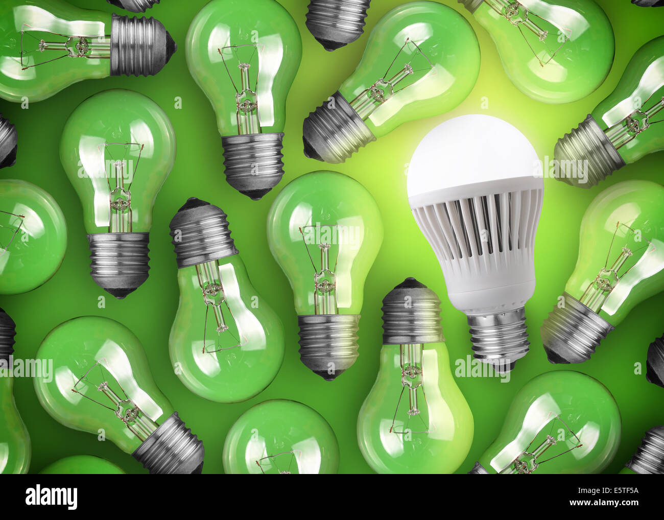 Concept for big idea. Glowing LED bulb on green background Stock Photo ...