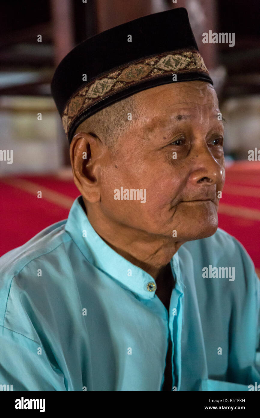 Yogyakarta, Java, Indonesia. Man Awaiting Noon Prayers, Great Mosque ...
