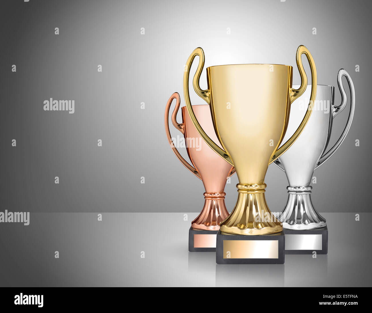 champion trophies on gray background Stock Photo - Alamy