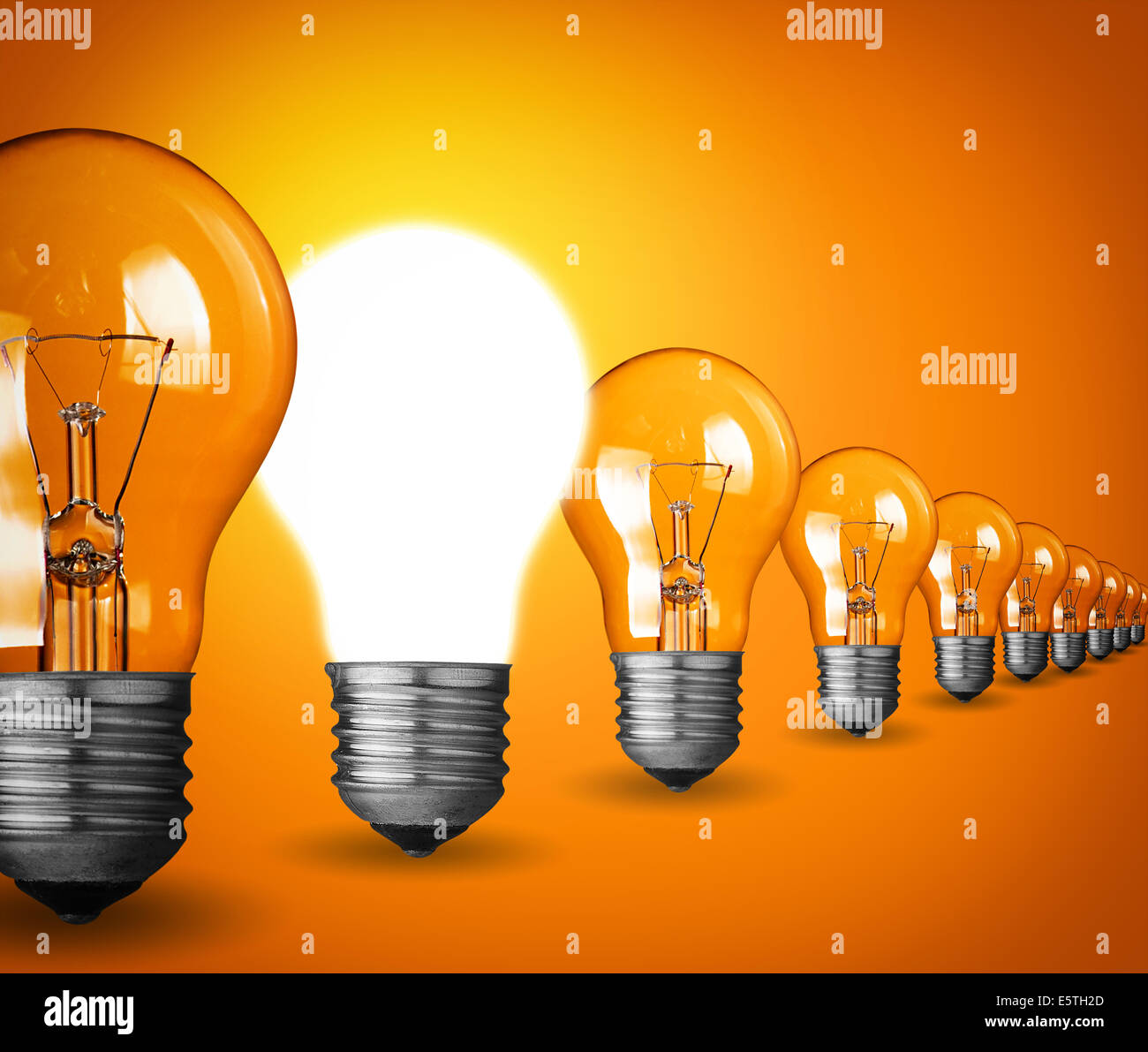 Idea concept with light bulbs on orange background Stock Photo - Alamy