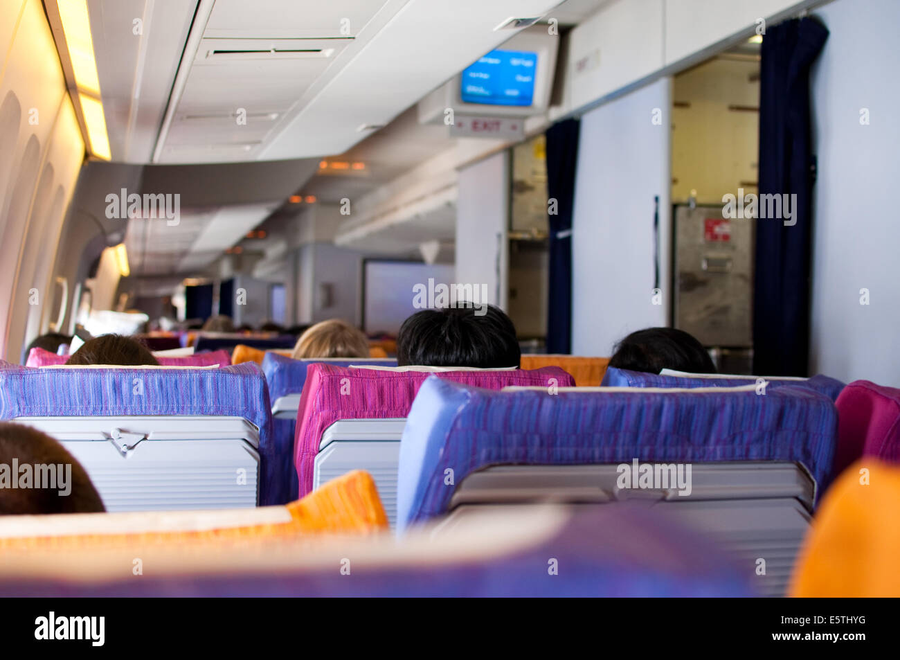 Airplane cabin interior exit sign hi-res stock photography and images ...