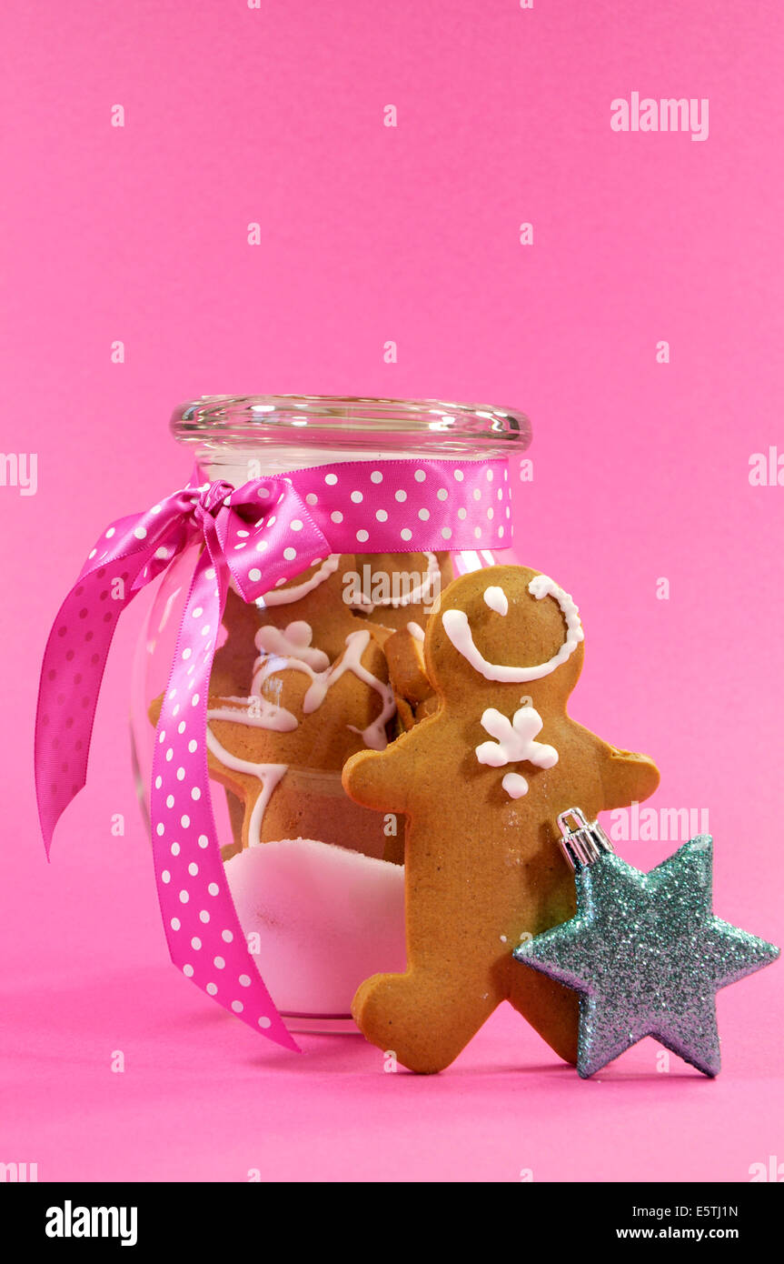 Merry Christmas festive gingerbread men in glass cookie jar with sugar ...