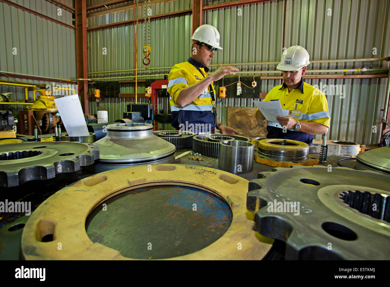 Mine managers discussing mining parts Stock Photo - Alamy