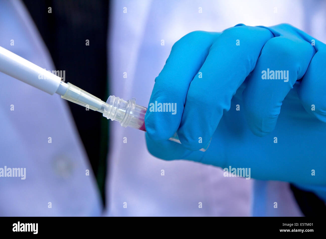 Pipette with drop of liquid in a science research lab Stock Photo - Alamy