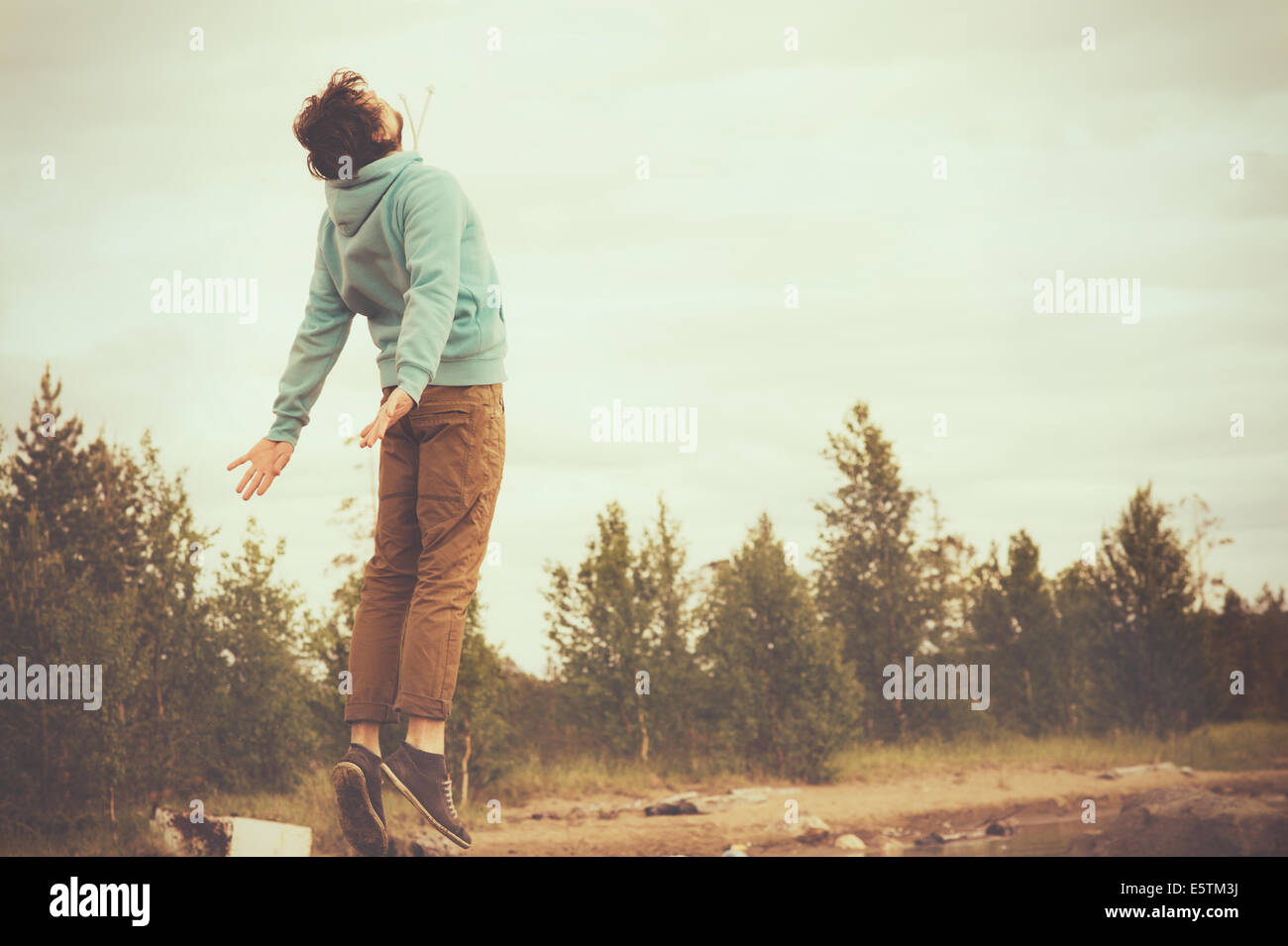 Young Man Flying levitation jumping outdoor relax Lifestyle happiness ...