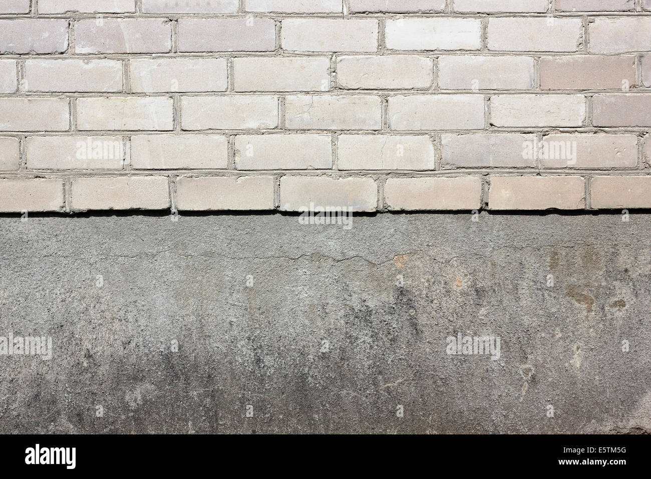 Sharp border between a white silicate bricks and plaster wall texture ...