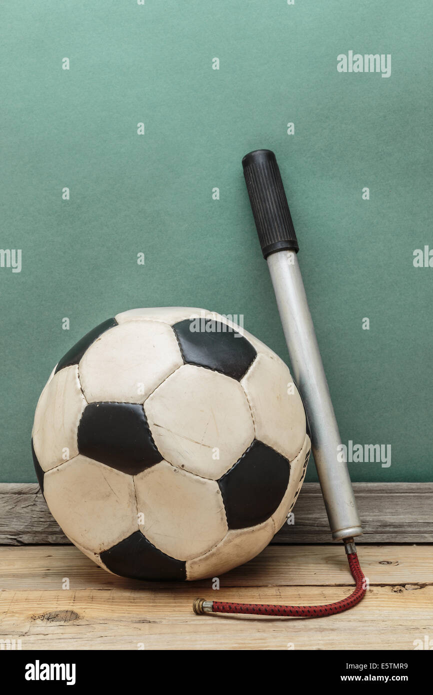 old deflated soccer ball Stock Photo - Alamy