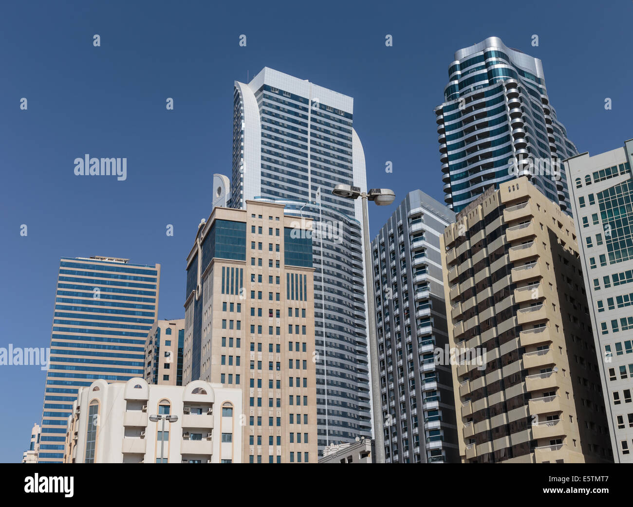 SHARJAH, UAE - OCTOBER 28, 2013: Modern buildings in Sharjah. It is the ...
