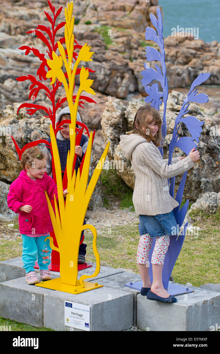 Kids playing on an outdoors statue Stock Photo - Alamy