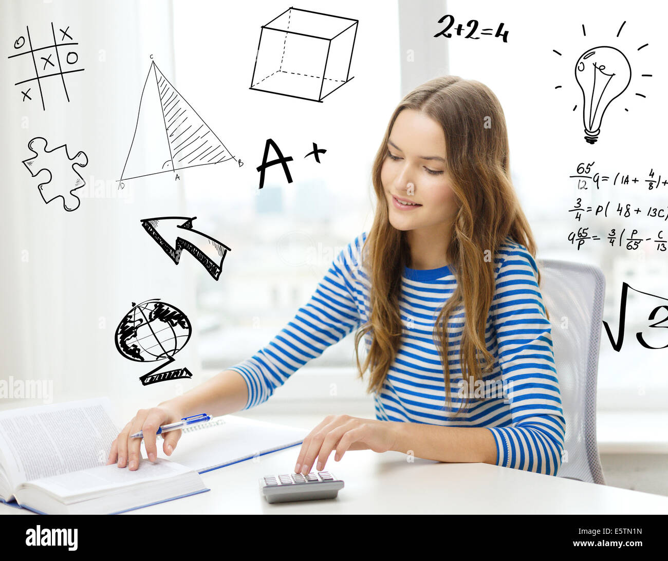 student girl with book, notebook and calculator Stock Photo - Alamy
