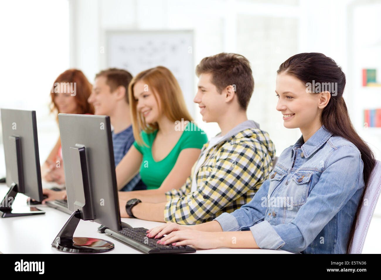 female student with classmates in computer class Stock Photo - Alamy