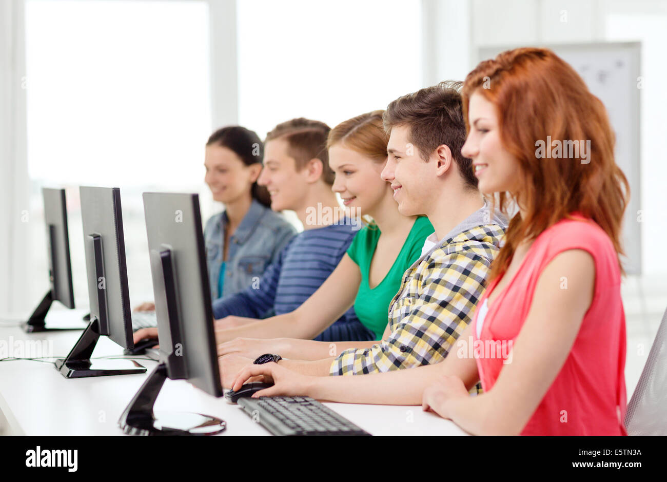 female student with classmates in computer class Stock Photo - Alamy