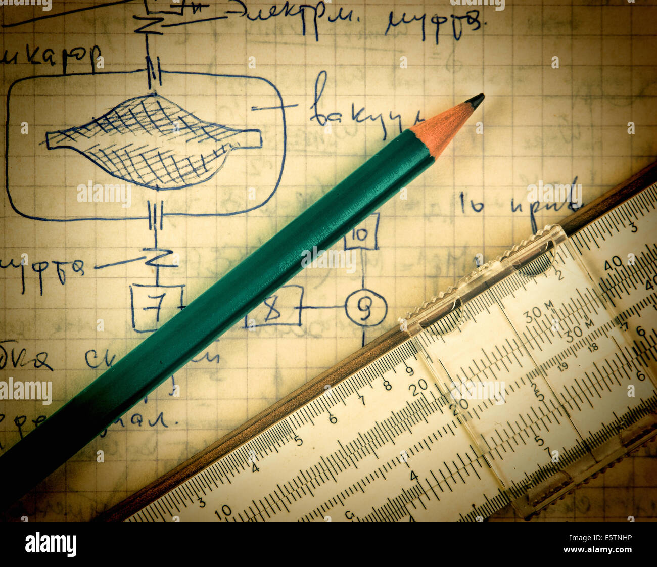 pencil and a slide rule on the old page with the calculations in ...