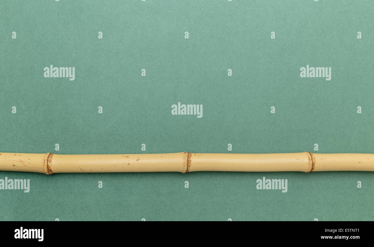 bamboo stick on a green background Stock Photo - Alamy
