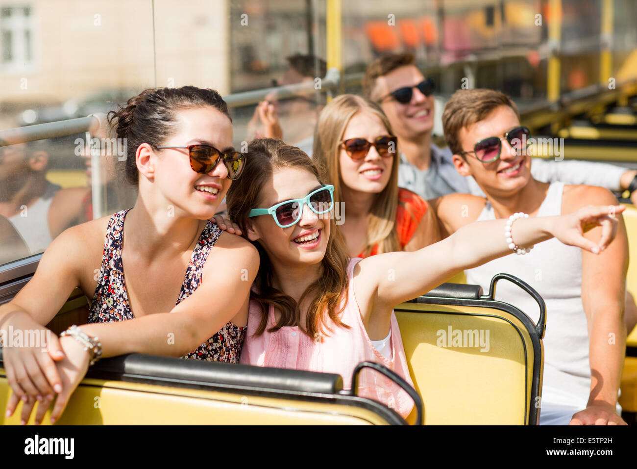 group of smiling friends traveling by tour bus Stock Photo - Alamy