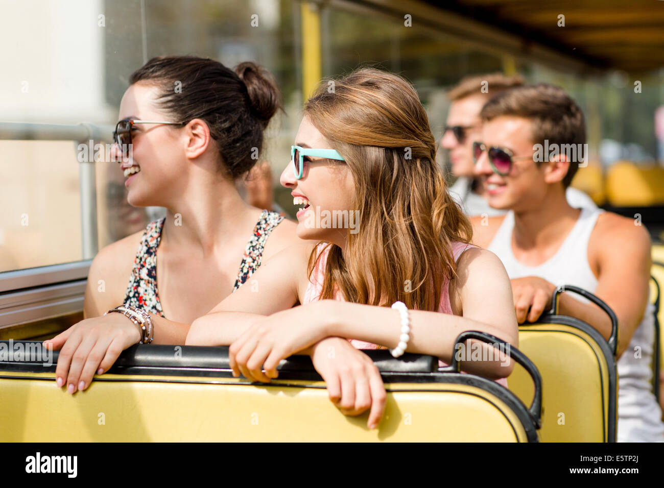 group of smiling friends traveling by tour bus Stock Photo - Alamy