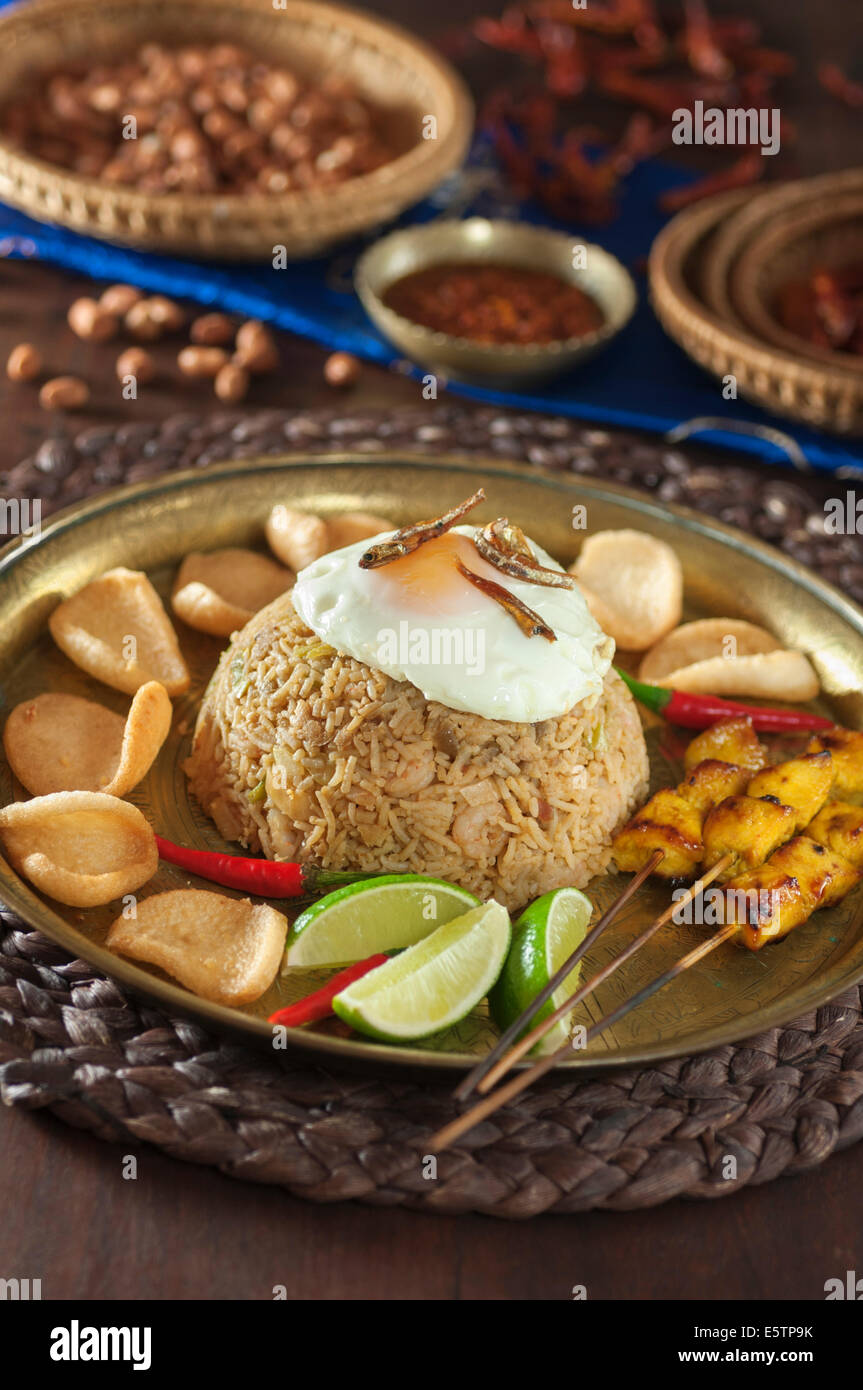 Nasi goreng. Indonesian fried rice with satay Stock Photo - Alamy
