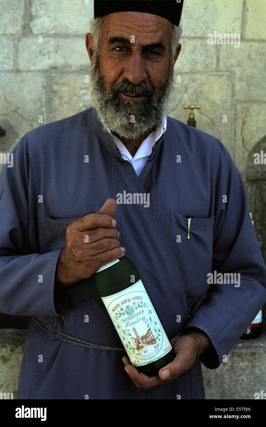PANAGIA,CYPRUS.A MONK WITH BOTTLED WINE PRODUCED AT THE PANAGIA ...