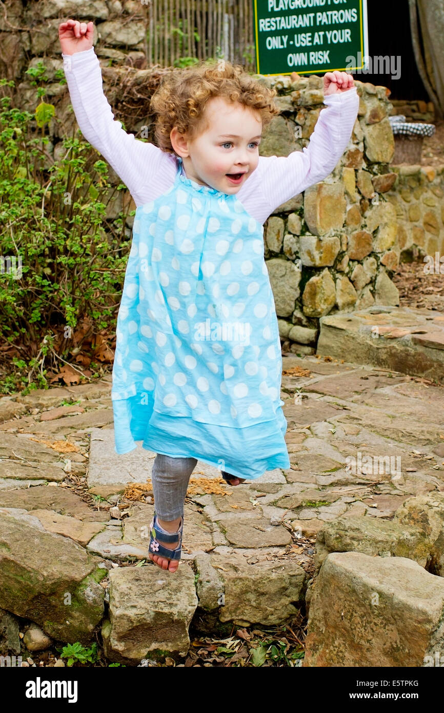 Young girl jumping for joy Stock Photo - Alamy