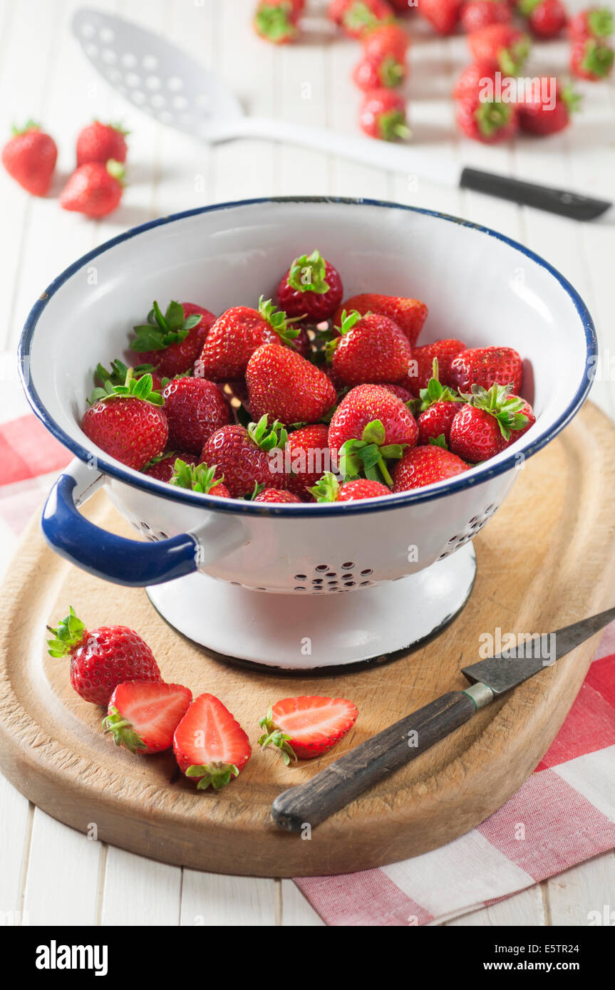 Strawberries in a colander Stock Photo - Alamy