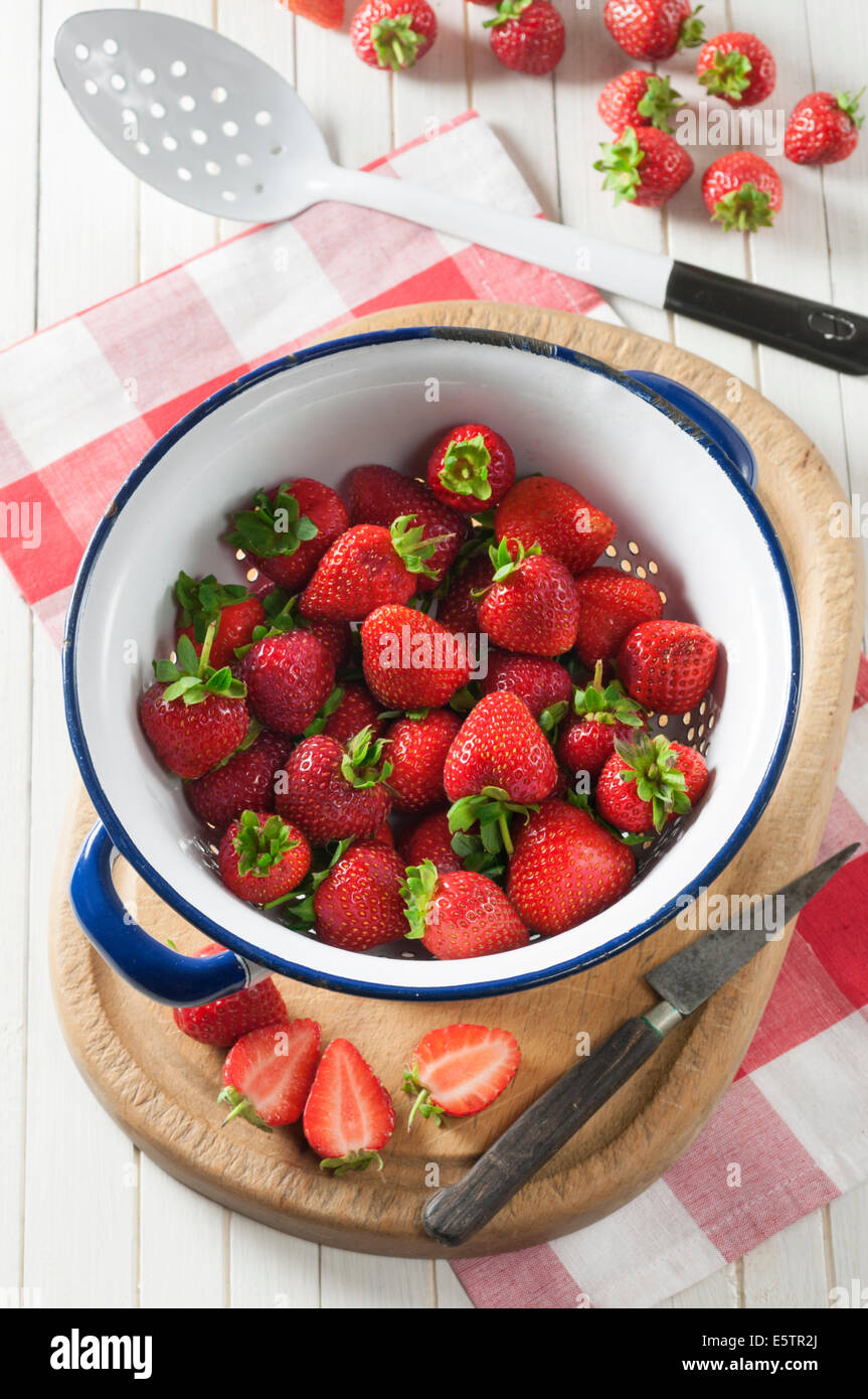 Strawberries in a colander Stock Photo - Alamy