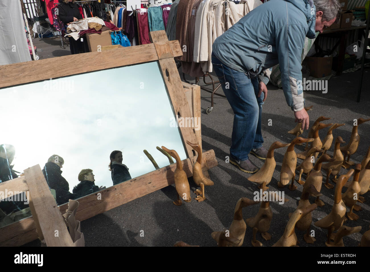 Market Stall Shoppers Mirror reflection Wooden Ducks Stock Photo - Alamy