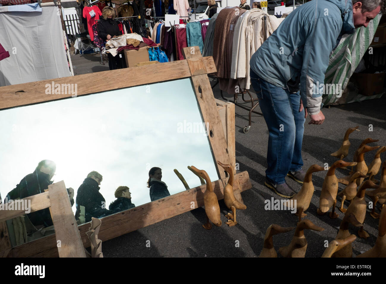 Market Stall Shoppers Mirror reflection Wooden Ducks Stock Photo - Alamy