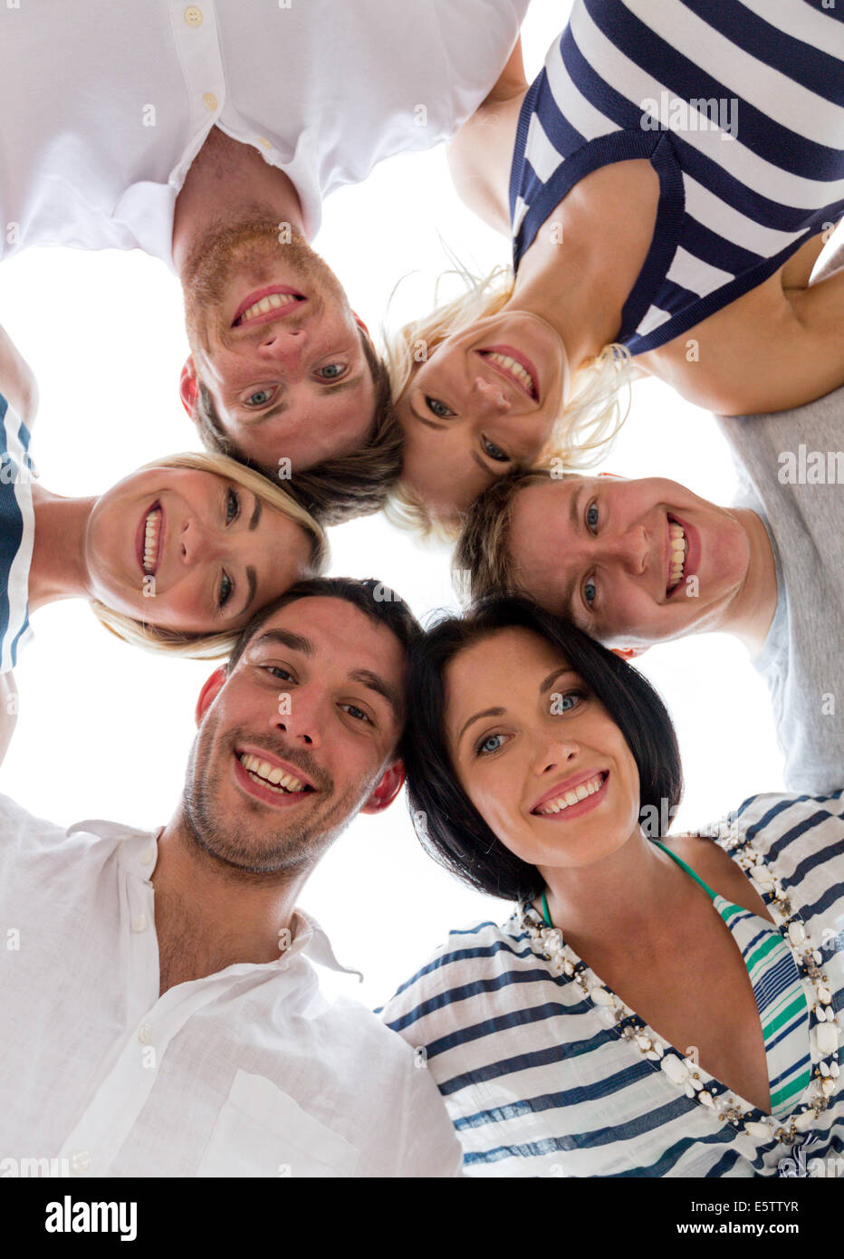 smiling friends in circle Stock Photo - Alamy