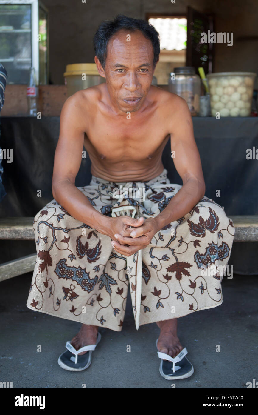 Balinese man sitting in a street cafe. Bali Indonesia Stock Photo - Alamy